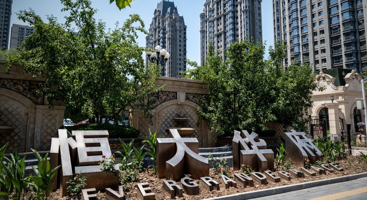 Evergrande halts trading after founder put under police control